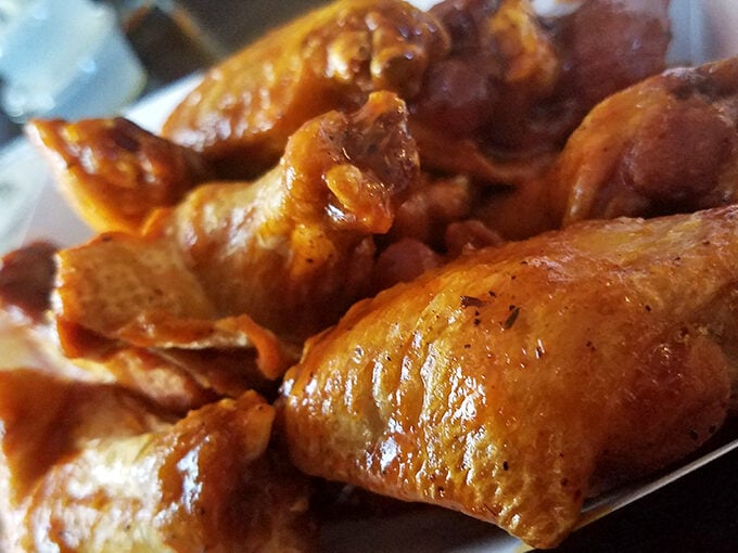 Wings that make you understand why napkins were invented. That glossy sauce isn't just coating the chicken—it's sealing in a promise of flavor.