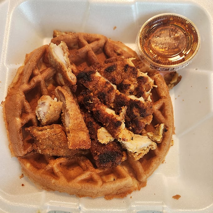 The chicken and waffle combo – where crispy meets fluffy in a breakfast marriage that somehow makes perfect sense at any hour.