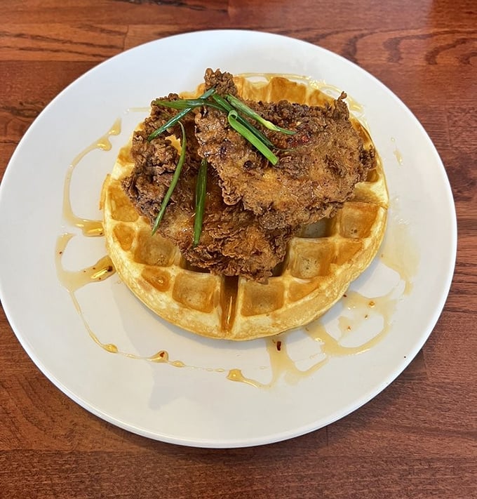 Chicken and waffles: the breakfast equivalent of a power couple, where crispy meets fluffy in a maple-drenched romance for the ages.