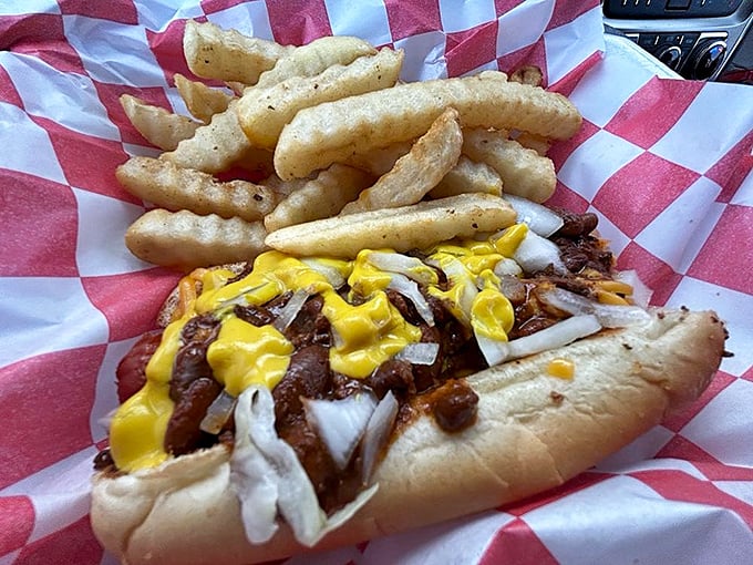 This isn't just a chili dog—it's a masterclass in American street food, where beef, cheese, onions, and bun achieve perfect harmony in every messy bite.