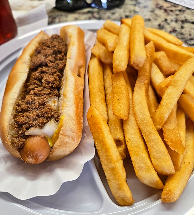 The chili dog at Mac's doesn't need fancy toppings to impress—just perfectly seasoned meat, a soft bun, and the confidence that comes from decades of practice.