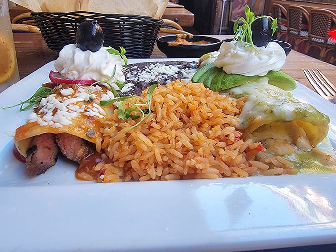 These chimichangas don't just sit on the plate—they command it, flanked by Spanish rice and refried beans like loyal courtiers to Mexican royalty.