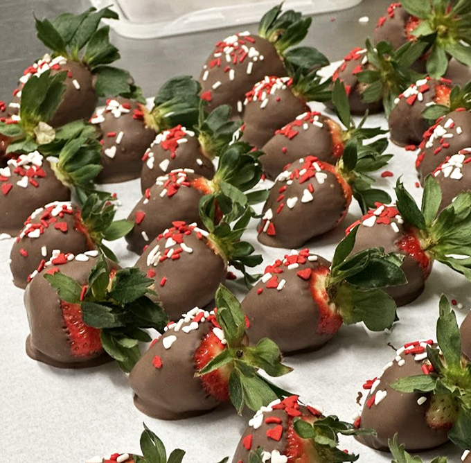 Those chocolate-covered strawberries are having way more fun than strawberries have any right to.