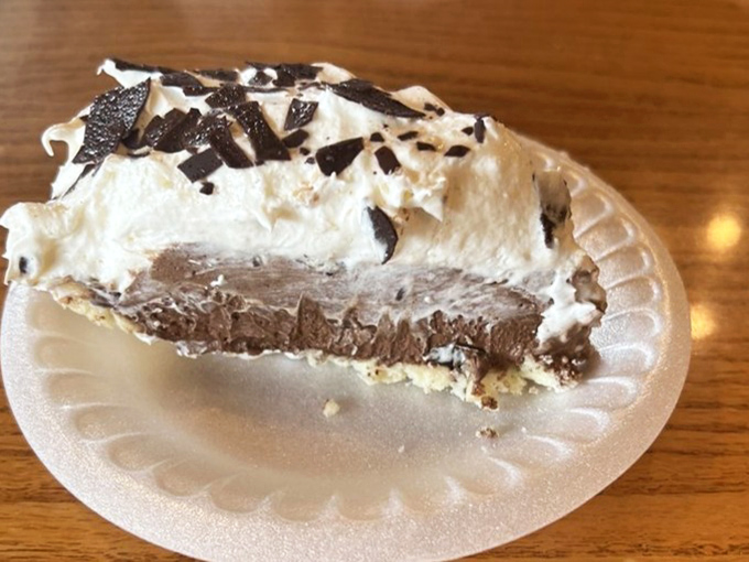 This chocolate cream pie doesn't just have layers of filling—it has layers of memories, topped with a cloud of whipped cream and chocolate shavings.