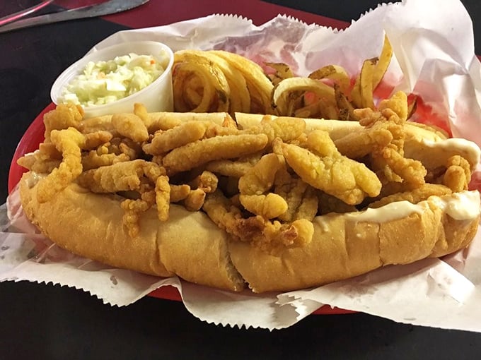 The clam roll arrives like a treasure chest overflowing with golden fried bounty. That toasted bun barely contains its delicious cargo—the coleslaw stands ready for backup.