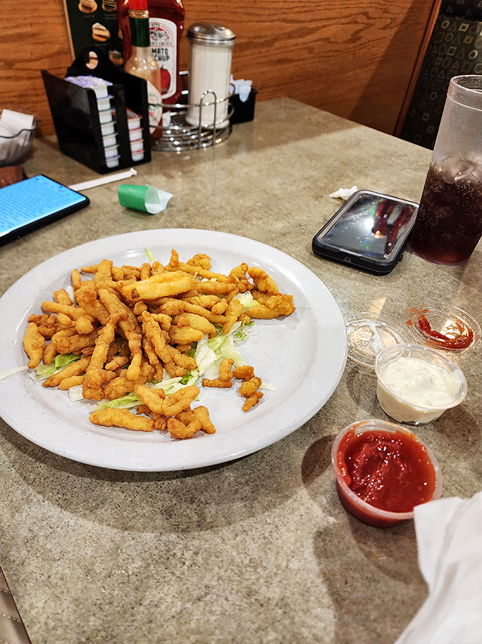 These clam strips aren't just fried – they're transformed into crunchy little wands of seafood magic that disappear faster than your diet resolutions.