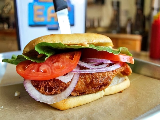 The cod sandwich—proof that Wisconsin's Friday fish fry tradition can be brilliantly reimagined in handheld form with crispy, flaky perfection.