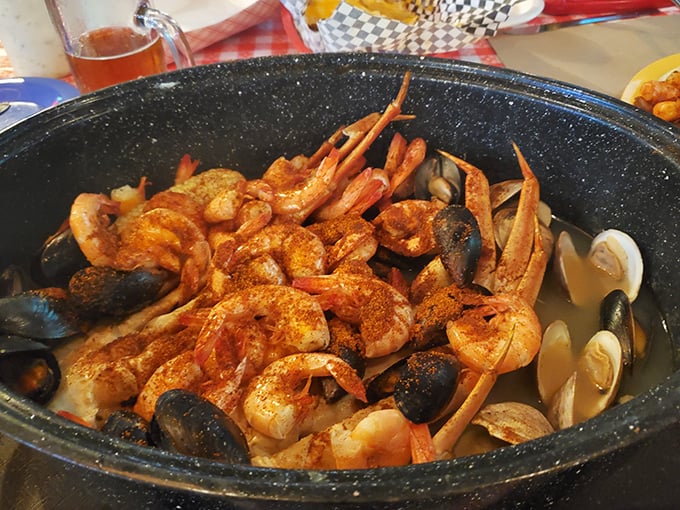 A seafood symphony in one pan—shrimp, mussels, clams, and crab legs swimming in seasoned broth. The ocean called; it wants its deliciousness back.
