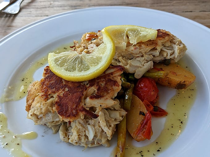 Crab cakes that actually deserve the name—mostly crab, barely cake, served with roasted vegetables that didn't just show up as an afterthought.