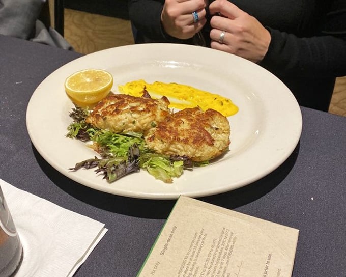 These crab cakes aren't playing games – all meat, minimal filler, and a golden crust that sings with each bite.
