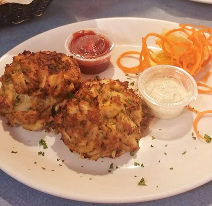 Maryland's famous crab cakes – golden-brown on the outside, succulent inside – served with a side of local pride and zero pretension.