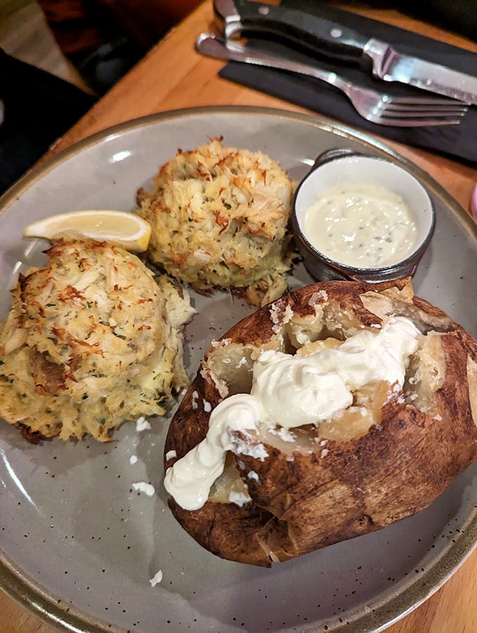 These crab cakes aren't playing games—golden-brown perfection with a loaded baked potato that's dressed for success. Maryland might get jealous.