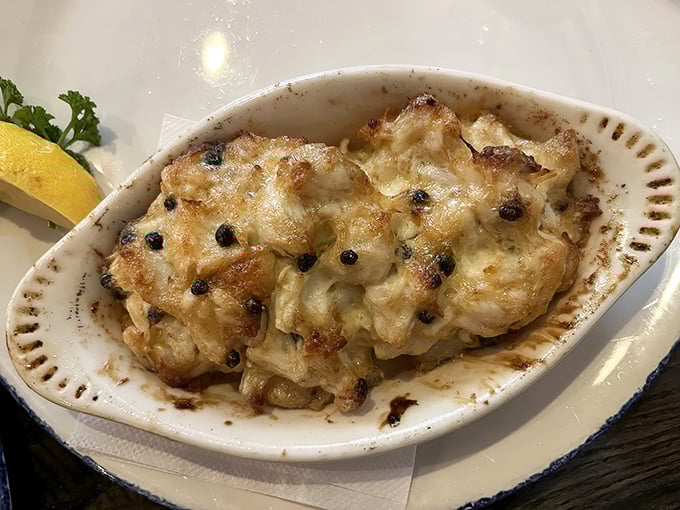 The Crab Imperial arrives looking like a bubbling masterpiece of creamy indulgence. If comfort food and luxury had a seafood baby, this would be it.
