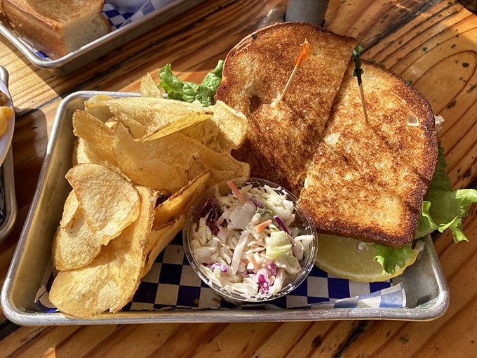 This grilled sandwich isn't just lunch—it's edible architecture. Golden-brown bread supporting the delicate balance of seafood and crisp lettuce.