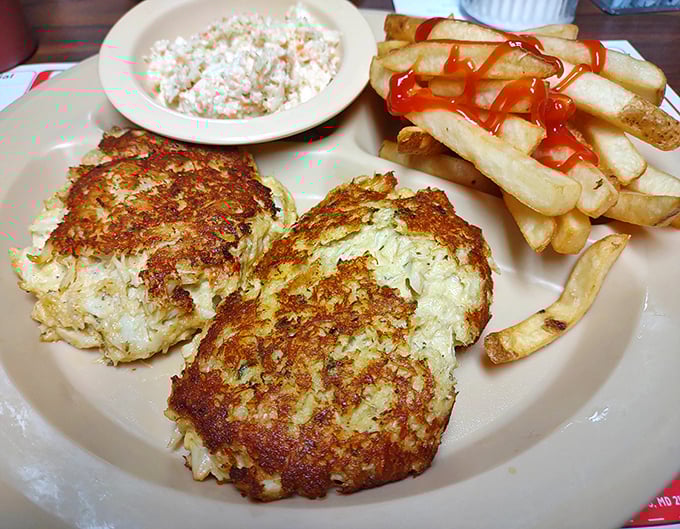 Golden crab cakes flanked by coleslaw and crispy fries show this place does lunch as seriously as breakfast.