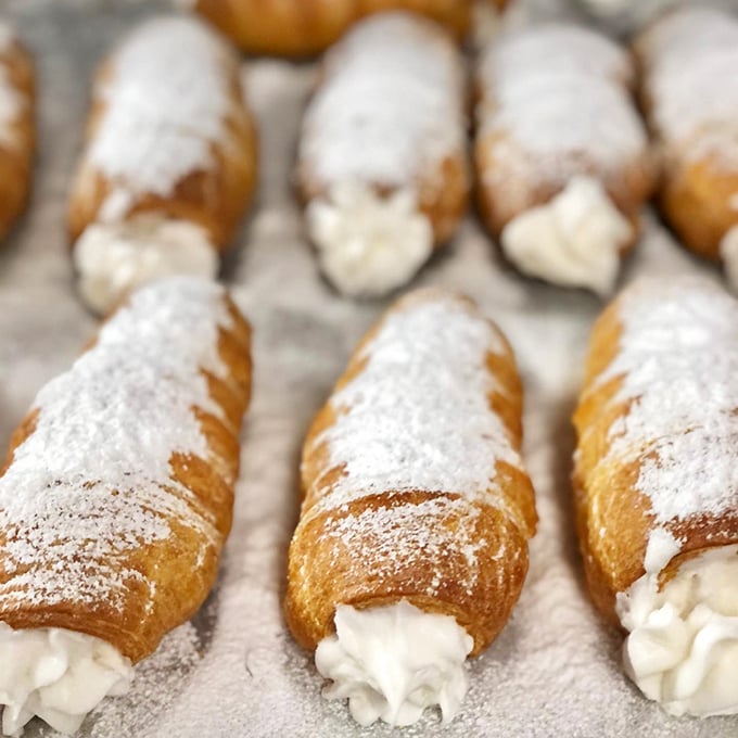 Cream horns that could make a French pastry chef weep with joy – delicate shells surrendering to clouds of vanilla-kissed filling.