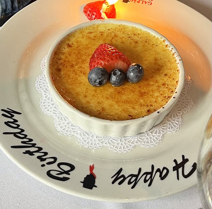 Crème brûlée with the perfect crack-worthy crust says "Happy Birthday" in the universal language of caramelized sugar. Those berries? Just showing off.