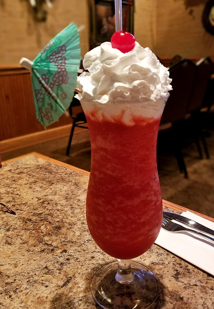 That frozen daiquiri isn't just a drink—it's dessert with attitude. The tiny umbrella isn't ironic; it's a promise of mini-vacation with every sip.