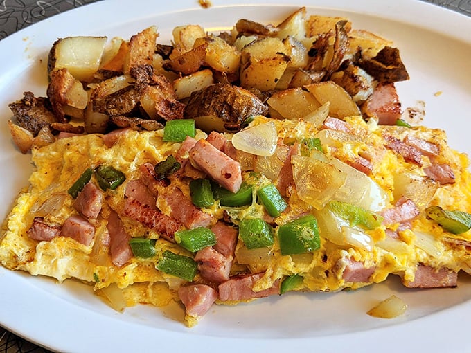 The Denver omelet at Mel's doesn't just visit the Mile High City—it takes you there with chunks of ham and peppers nestled in fluffy egg clouds.