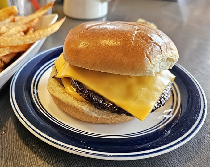 The double cheeseburger arrives like a beautiful, messy challenge. Your shirt may not survive, but your soul will thank you.