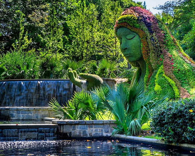 Serenity personified—the Earth Goddess rests beside cascading waters, her face a canvas of living plants changing with each passing season.
