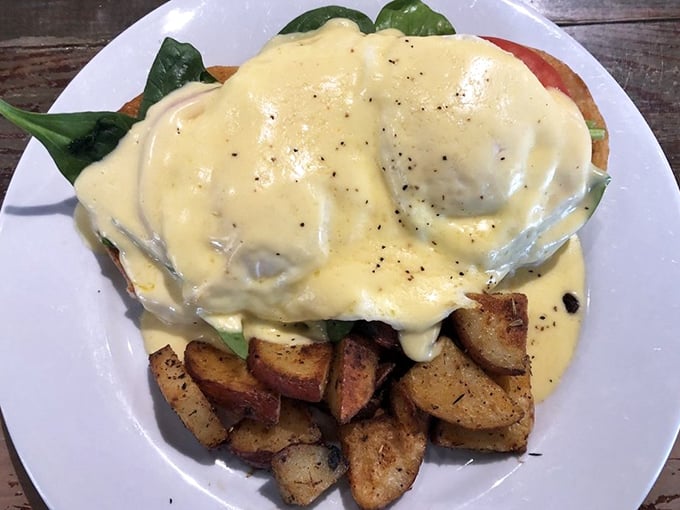 This Eggs Benedict isn't just breakfast—it's a sunrise ceremony where hollandaise sauce performs sacred rituals over perfectly poached eggs.
