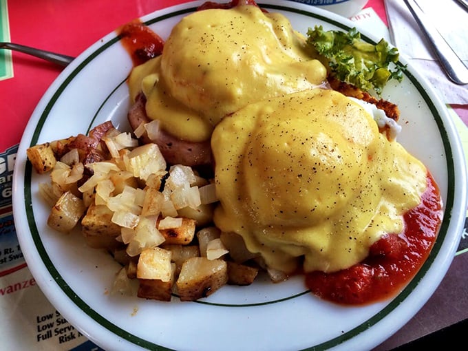 Eggs Benedict done right: perfectly poached eggs nestled on savory ham, draped in hollandaise that's rich enough to make you forget about tomorrow's cholesterol test.