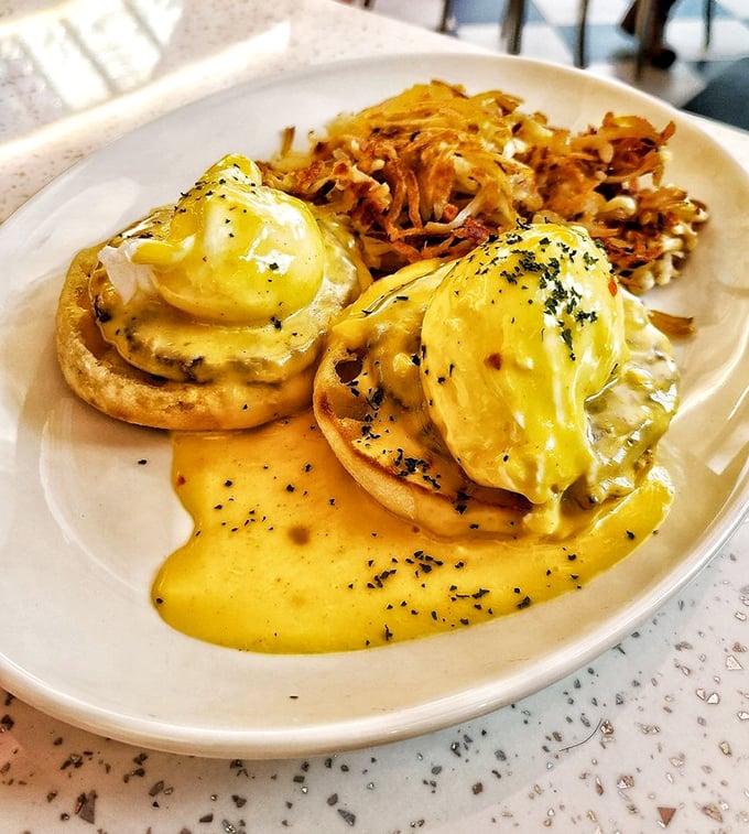 Eggs Benedict that would make the Pope himself convert to breakfast worship. That hollandaise sauce looks like liquid sunshine.