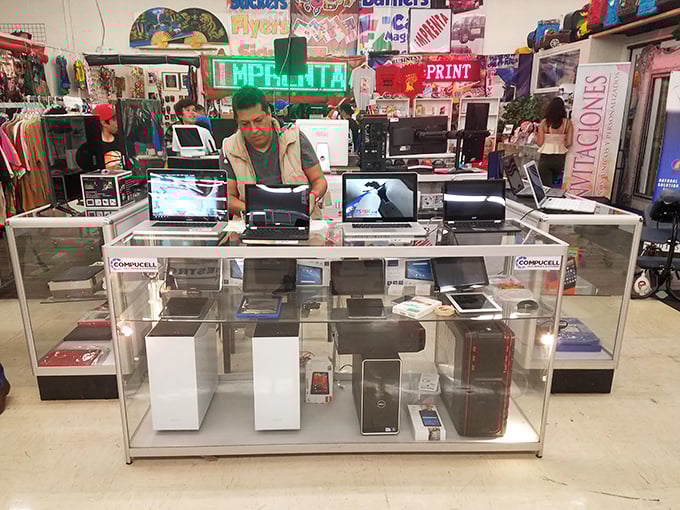 The electronics booth—where yesterday's cutting-edge technology finds tomorrow's appreciative owner. That laptop might not run the latest games, but it'll handle your taxes just fine.