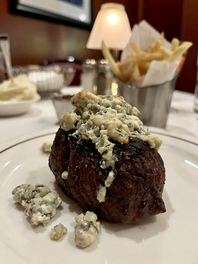 This blue cheese-crowned filet mignon isn't just a steak—it's a meditation on beef perfection that makes vegetarians question their life choices.