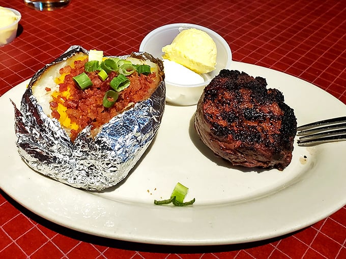 A filet that would make cowboys weep with joy, paired with a loaded baked potato wrapped in foil like a delicious silver present.