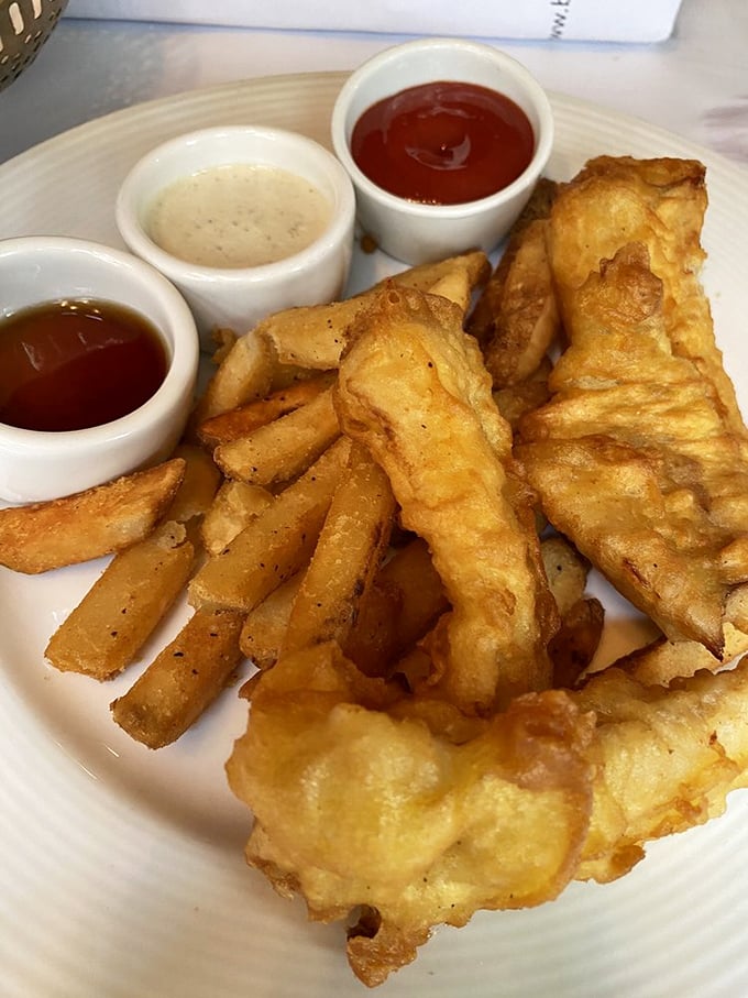 Fish and chips that would make a Londoner homesick – golden, crispy batter surrounding flaky white fish with three dipping sauces for your dunking pleasure.