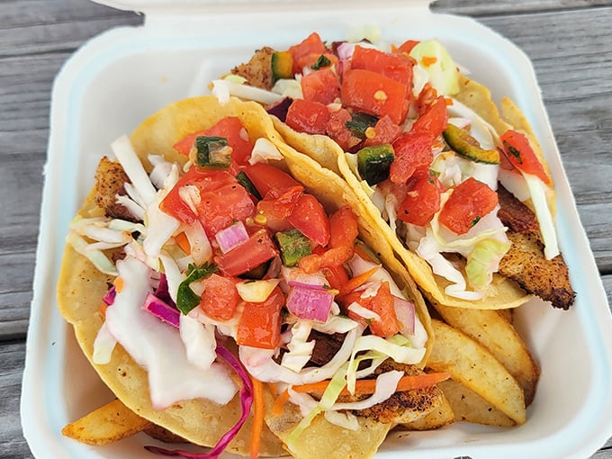 Behold the star of the show! Fresh fish nestled in soft tortillas with vibrant pico and cabbage—a flavor explosion that justifies the journey.