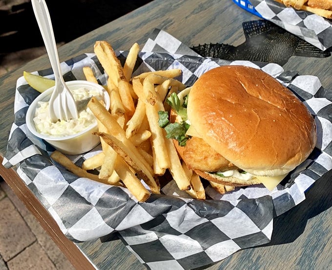 The whitefish sandwich—where brioche bun meets lightly fried Great Lakes treasure. A portable feast that makes you wonder why you'd ever settle for fast food again.