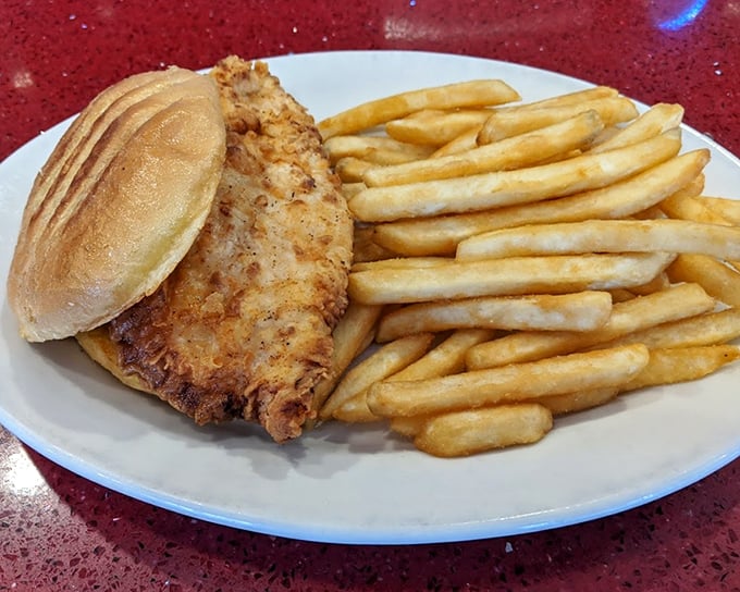 Golden fries that achieve the impossible balance – crispy exterior giving way to fluffy potato clouds within. Pure alchemy.