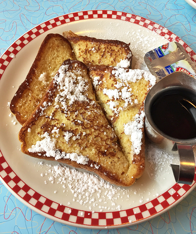 French toast that's dressed for success with a snow shower of powdered sugar. Breakfast royalty that makes cereal look like peasant food.