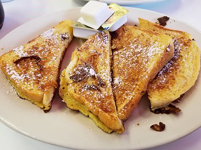 French toast that makes breakfast-for-dinner not just acceptable but practically mandatory. Powdered sugar dusting: the adult version of snow days.