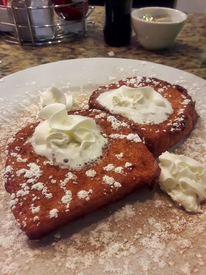 French toast that's achieved celebrity status—dressed in powdered sugar with dollops of whipped cream that melt like snowflakes on a warm morning.