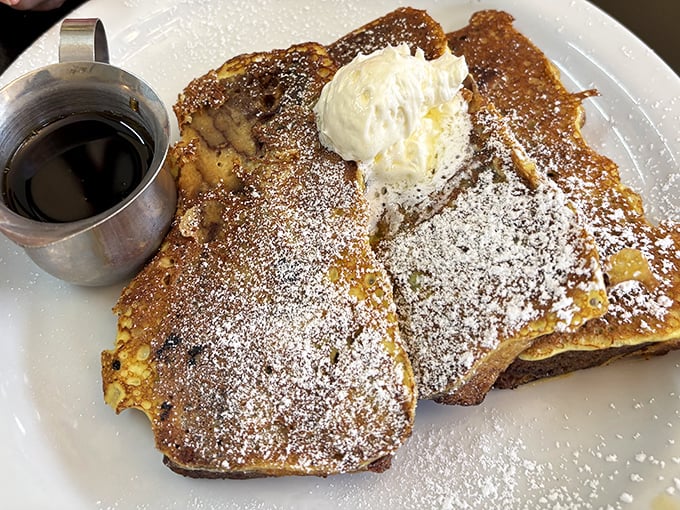 French toast that's achieved the impossible trifecta: crispy exterior, custardy interior, and enough powdered sugar to make your inner child giggle with delight.