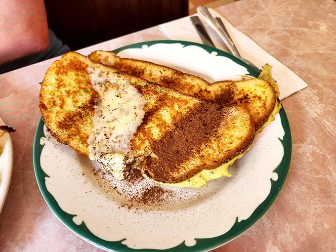 French toast that's achieved golden-brown perfection. That dusting of cinnamon isn't just for show—it's the exclamation point on a breakfast masterpiece.