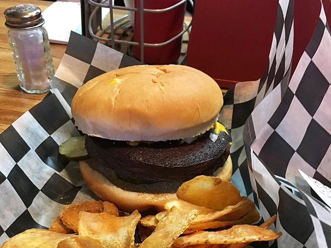 Behold the burger that launched a thousand road trips – thick, juicy, and demanding both hands and several napkins.