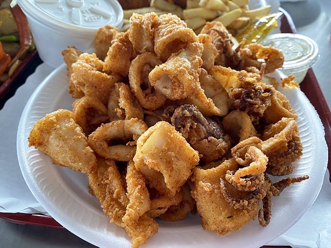This mountain of crispy calamari could convert even the most stubborn squid skeptic—tender morsels in a crunchy golden jacket that would make Colonel Sanders jealous.