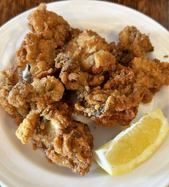 These fried oysters aren't just appetizers—they're little crispy miracles from the sea, waiting for that squeeze of lemon to bring them to life.