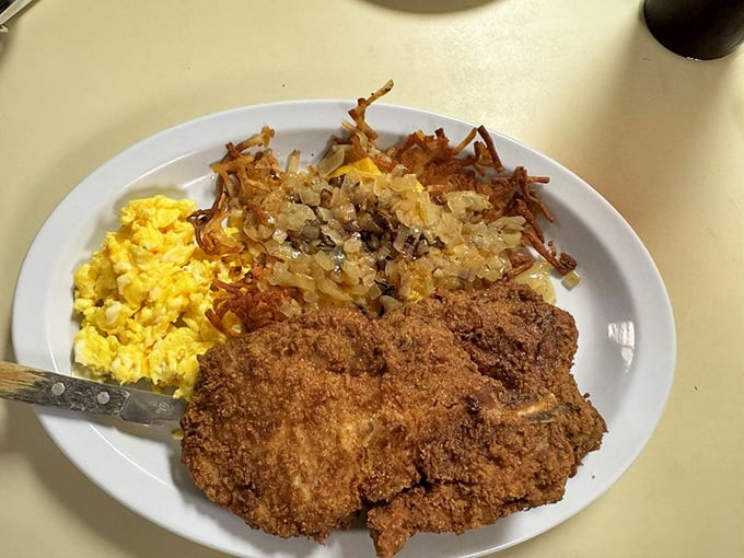 Golden-fried perfection meets fluffy scrambled eggs and hash browns. This plate doesn't just feed your body—it hugs your soul from the inside out.