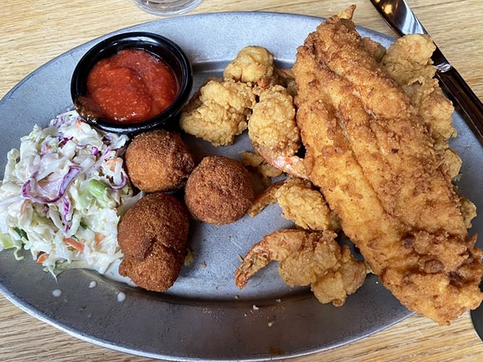 The Fried Seafood Platter arrives like edible beach treasure—golden, crispy, and demanding to be photographed before it disappears.