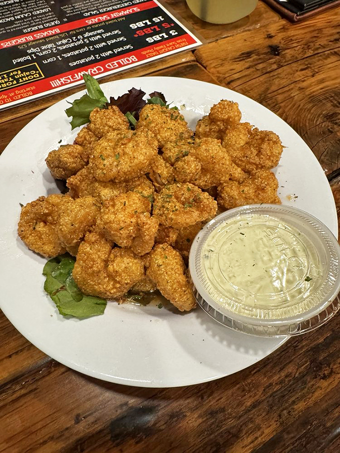 Golden-fried shrimp that crunch like nature's perfect potato chip—except inside is sweet, tender seafood that makes you close your eyes in appreciation.