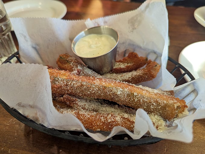 These aren't your average zucchini sticks. Crispy, dusted with parmesan, and served with a dipping sauce that'll make you forget vegetables were involved.