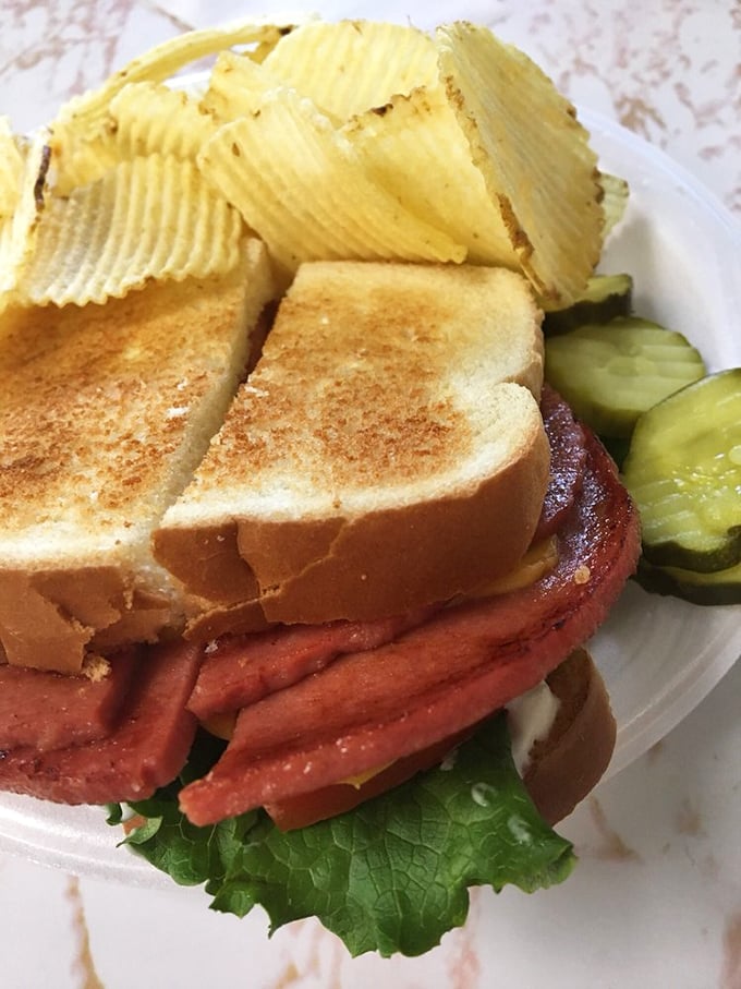 The legendary fried bologna sandwich – where humble lunch meat gets the star treatment it deserves. Those crispy edges are worth crossing county lines for.