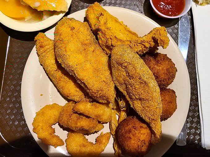 Golden-brown catfish that shatters with each bite, paired with hushpuppies that could make a vegetarian question their life choices.