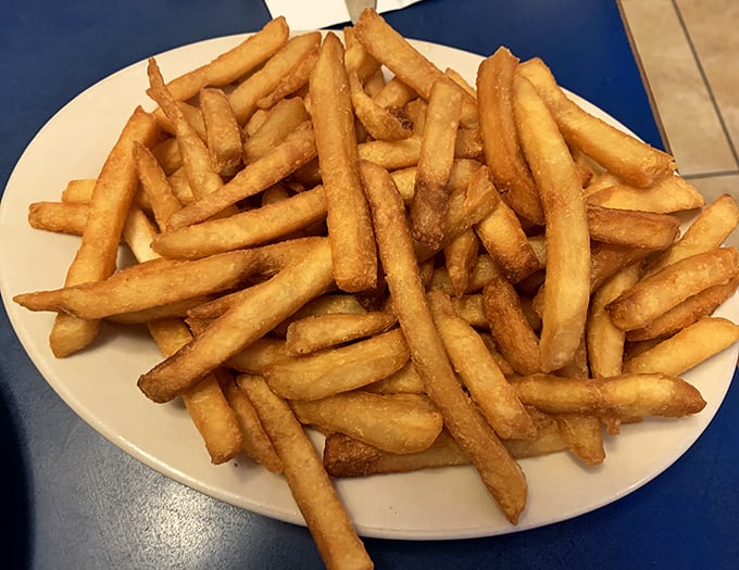 Golden fries that achieve the impossible balance of crispy exterior and fluffy interior—the supporting actor that sometimes steals the show.